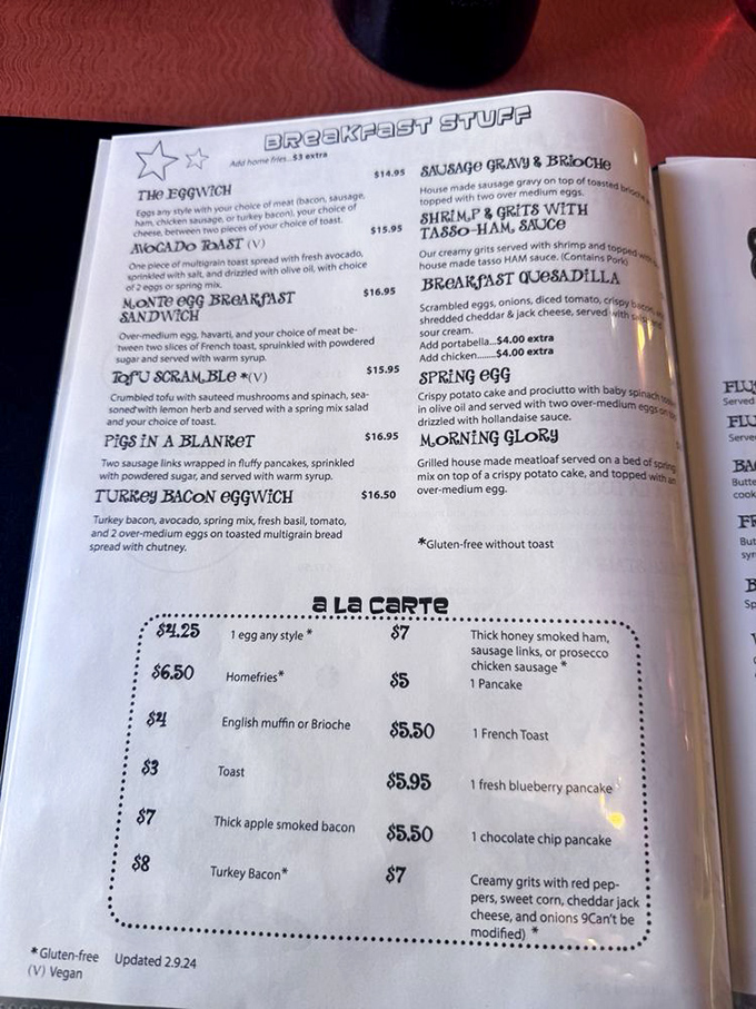 The menu reads like a love letter to breakfast. Each dish name—from "Pigs in a Blanket" to "Morning Glory"—promises a story along with your meal.