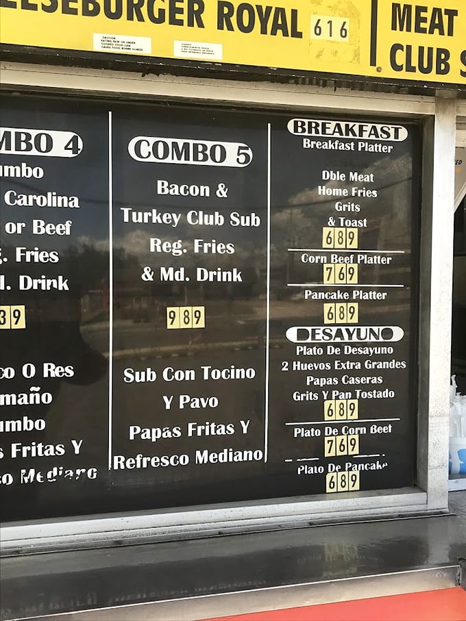 This menu board tells a story of American classics with bilingual flair&mdash;where breakfast platters and club subs share space with "Desayuno" offerings.