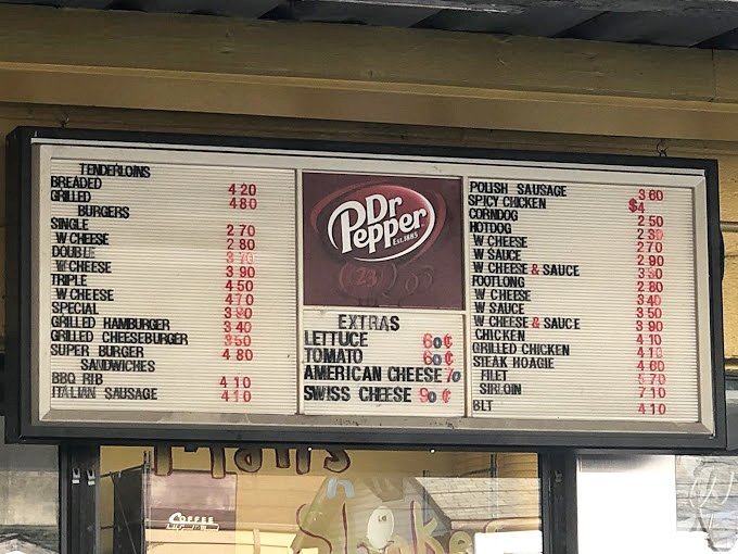 The menu board &ndash; a glorious shrine to comfort food classics where decisions become delightfully difficult.