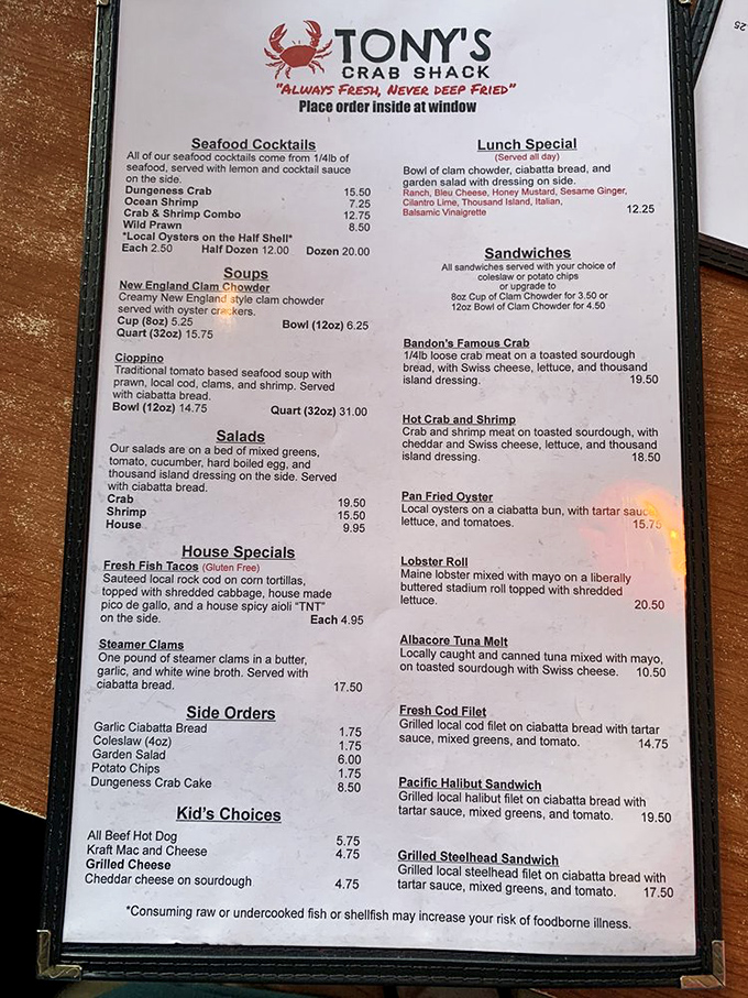 This menu isn't just a list—it's a treasure map. Each item represents X-marks-the-spot for seafood lovers, with Bandon's Famous Crab Sandwich as the crown jewel.