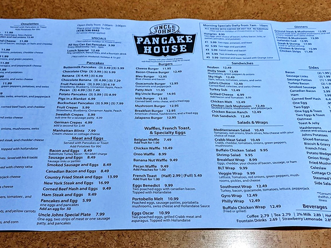 The menu at Uncle John's—a sacred text of breakfast possibilities that requires both strategy and ambition to navigate properly.