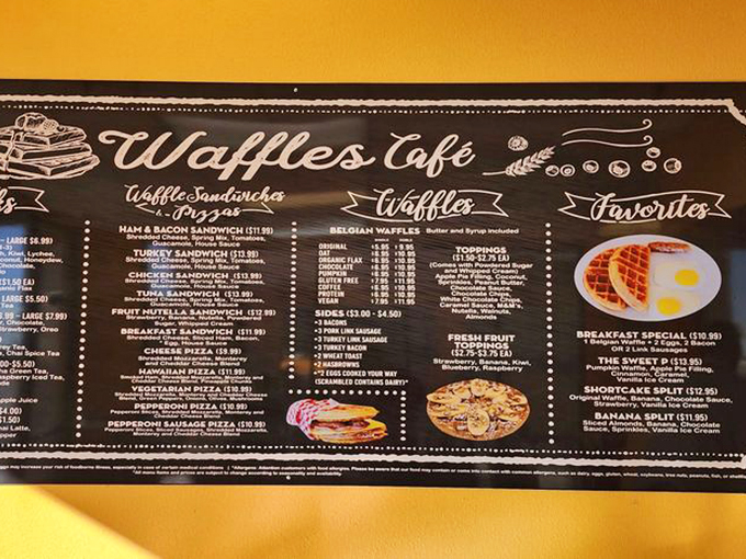 The chalkboard menu reads like a love letter to carbohydrates, with waffle creations that range from sensible to "I'm on vacation, calories be damned."