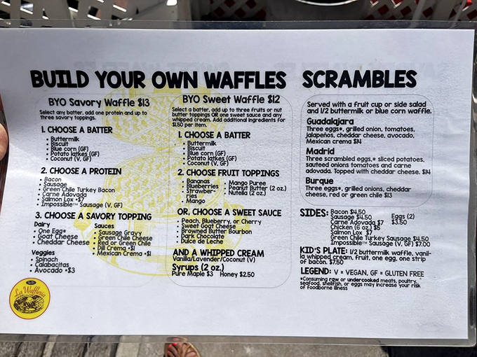 The menu board reads like a choose-your-own-adventure novel where every ending involves delicious waffles. Decision paralysis has never been so delightful.