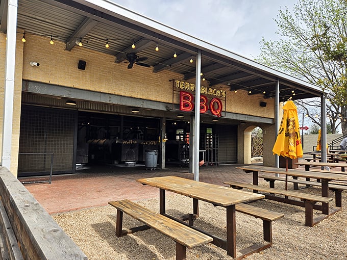 At Black's BBQ, the neon sign is just the beginning of the story. What happens inside those doors is nothing short of meat magic.