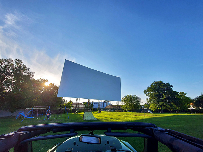 That massive white screen against the blue sky isn't just a movie canvas&mdash;it's 120 feet of possibility waiting for darkness to work its magic.