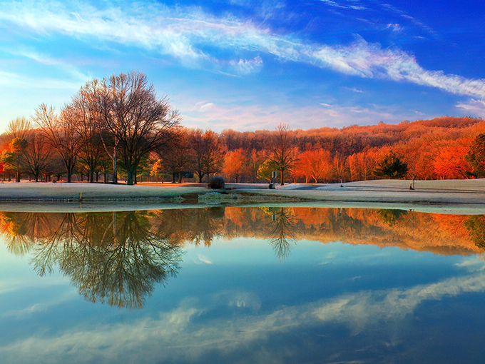 Bella Vista's serene waters reflect both clouds and sensible retirement planning &ndash; nature's beauty without the premium surcharge.