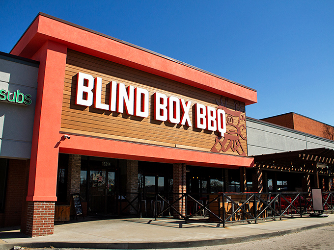 Blind Box BBQ's bright orange welcome &ndash; like a sunset-colored beacon guiding hungry souls to smoked meat paradise.