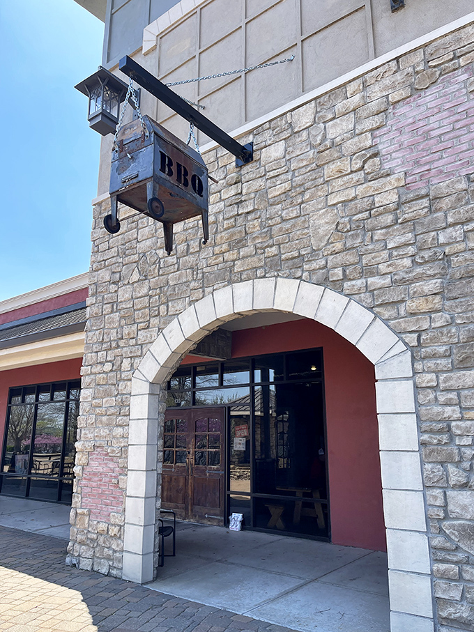This stone archway entrance feels like passing through BBQ's pearly gates. Salvation by smoke awaits.