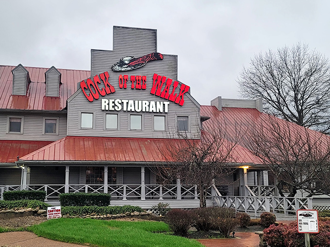 Cock of the Walk's distinctive red-roofed building looks like it should be on a postcard labeled "Authentic Southern Charm, Now Serving Catfish."