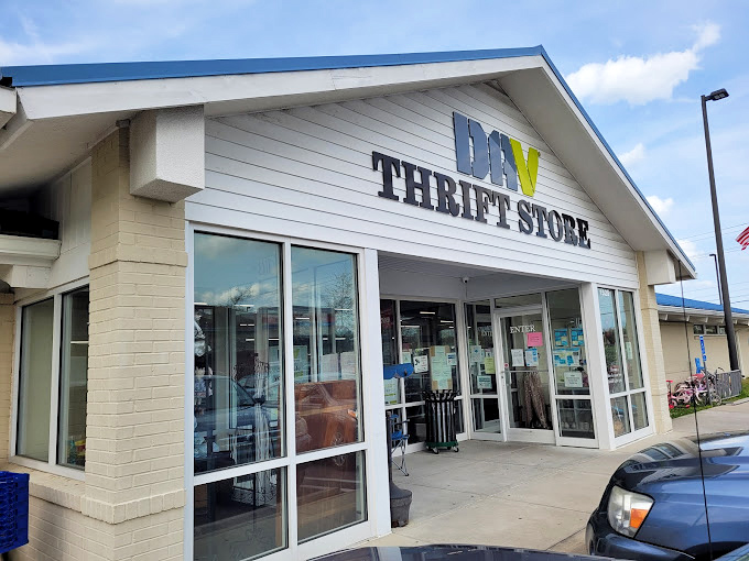 DAV Thrift Store's clean white exterior hides a wonderland of pre-loved treasures. Like a book waiting to be judged by its contents!