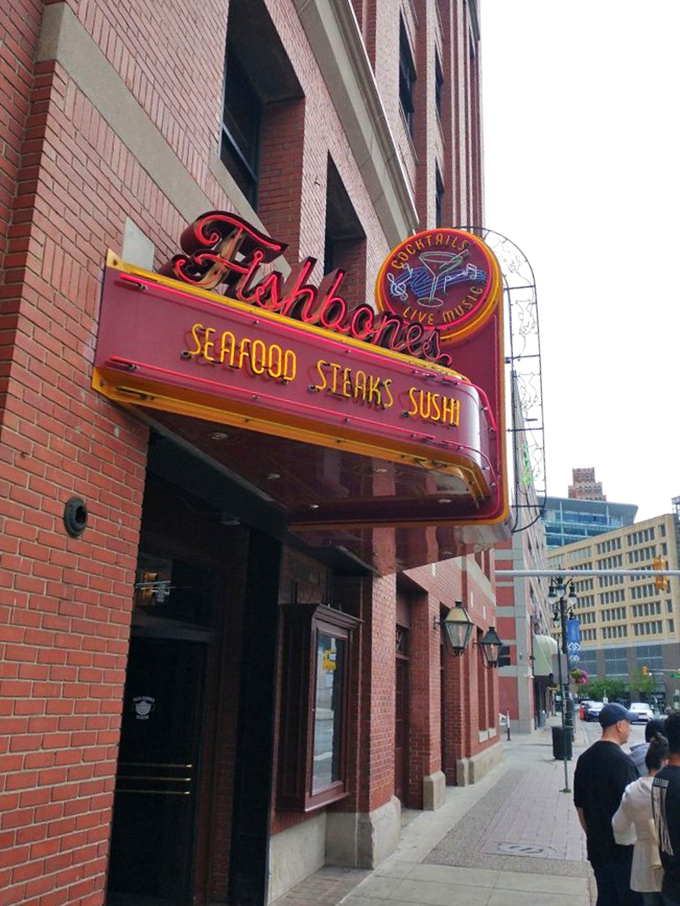 Fishbone's neon sign glows like a lighthouse for the hungry souls navigating downtown Detroit's culinary waters.