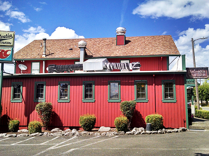 The Helvetia Tavern's barn-red exterior is like a beacon for burger lovers. Rural setting, legendary reputation. 