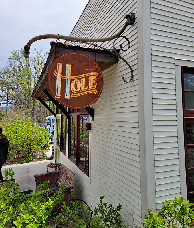 Hole's rustic sign swings like an invitation to donut paradise, where simplicity and quality reign supreme.