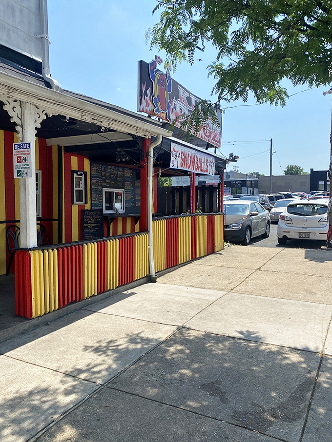 Killa Dogz's carnival-bright stand is like the Willy Wonka factory of hot dogs—vibrant, whimsical, and completely irresistible.