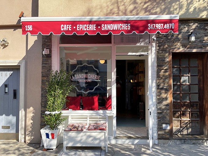 La Sandwicherie's cheerful red awning brings a splash of Parisian charm to Brooklyn's industrial landscape.
