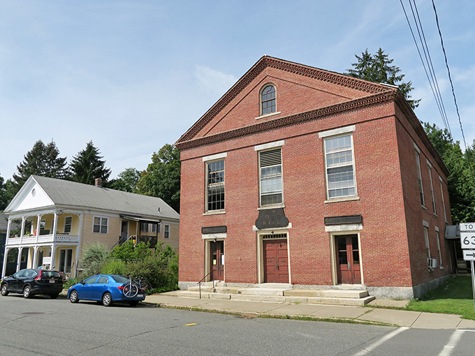 Explore the historic charm of Montague as you wander past this classic brick town hall on a bright, peaceful afternoon.