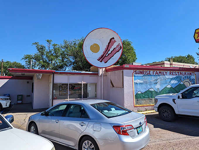 Sunrise Family Restaurant's egg-and-bacon sign isn't subtle - it's a giant billboard screaming "breakfast is serious business here!"