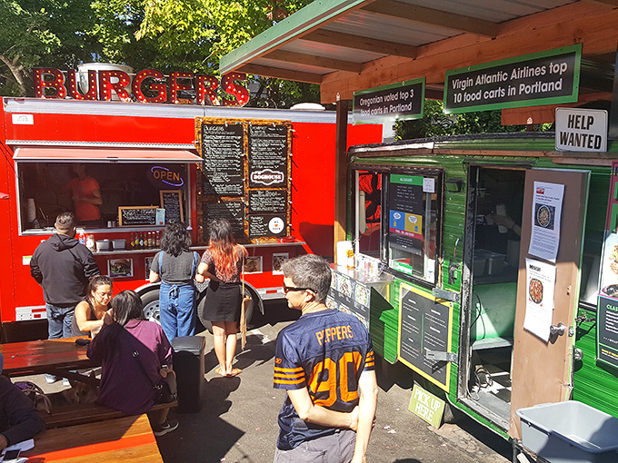 Food cart heaven where the red "BURGERS" sign might be misleading, but the hot dog artistry is anything but.