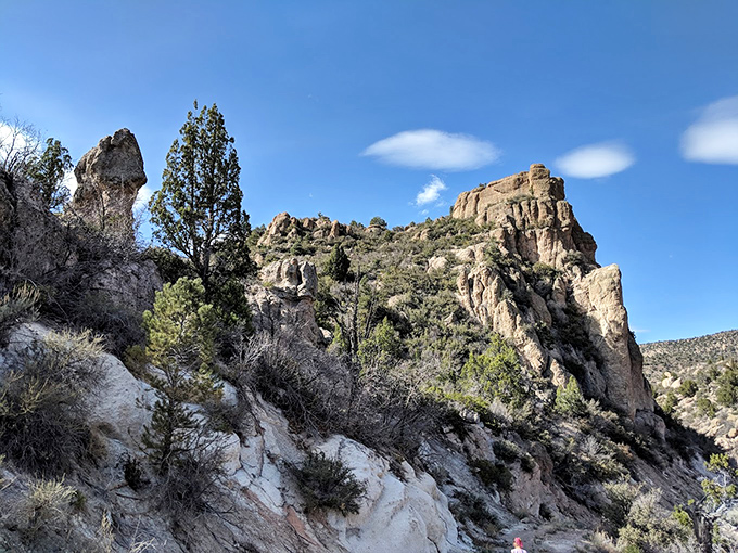 Rugged rock formations rise dramatically against the blue sky at Beaver Dam. Mother Nature showing off her architectural portfolio in spectacular fashion.