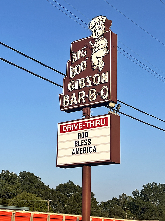 That cheerful pig chef on the sign isn't just cute &ndash; he's announcing some of Alabama's most celebrated BBQ. The "Drive-Thru" sign is your express ticket to flavor town.