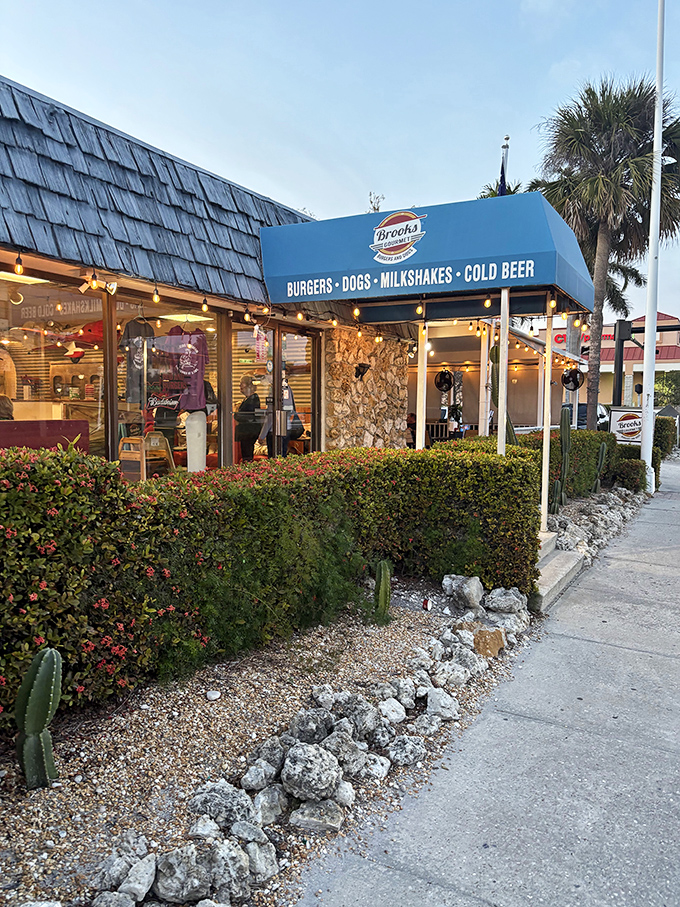 As evening falls, Brooks' blue awning becomes a beacon of burger hope for hungry Naples wanderers.