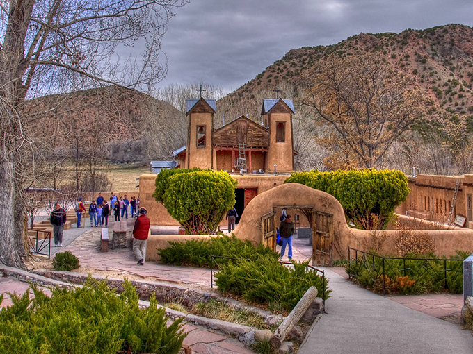 Golden evening light bathes this sacred church, where faith and history intertwine beneath New Mexico's endless sky.
