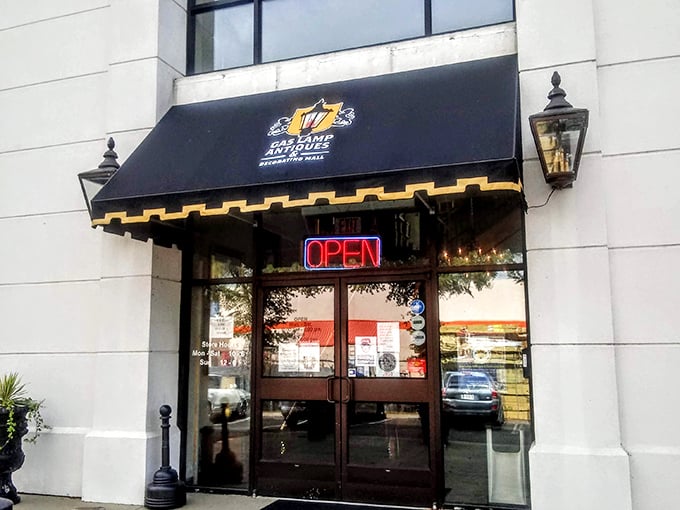 That black awning with gold trim is the antique world's equivalent of a velvet rope &ndash; what waits inside is worth dressing up for.