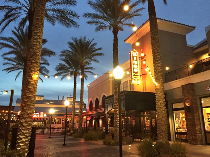 King's Fish House transforms Henderson into a coastal getaway with twinkling lights and palm trees framing its impressive entrance.