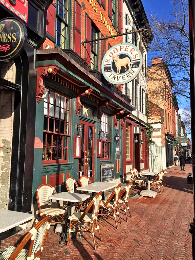 Bistro chairs line the brick sidewalk outside Kooper's Tavern, inviting passersby to sit and savor a moment of burger perfection.