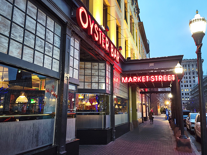 The glowing "OYSTER BAR" sign isn't just illumination&mdash;it's a beacon of hope for landlocked seafood lovers seeking coastal comfort in the desert.