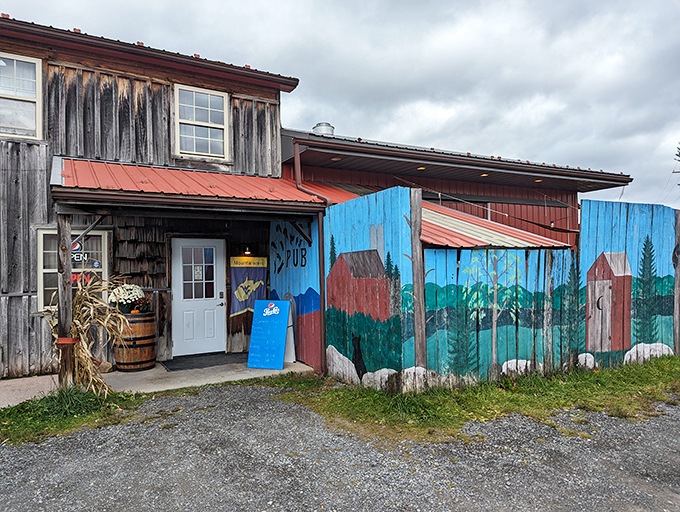 Those blue-painted fence panels hide a pizza paradise where wood-fired crusts and craft beer live in perfect harmony.