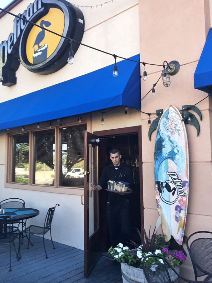 The surfboard by Pelican's entrance reminds us we're about to "catch a wave" of flavor. Surf's up in the Southwest!