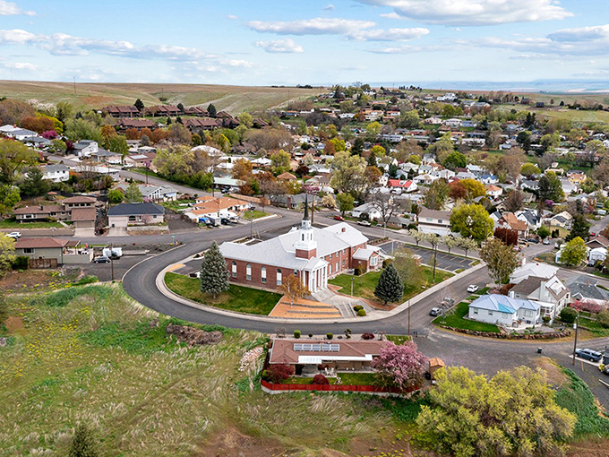 This bird's-eye view of Pendleton reveals a charming community nestled among golden hills &ndash; a budget-friendly slice of the American West.