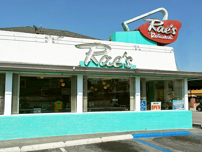 That vintage neon sign has been guiding hungry souls to burger paradise since before kale was something people voluntarily ate.