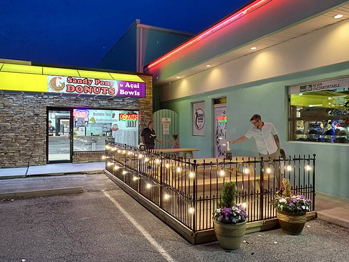 Evening lights transform Sandy Pony into a magical donut wonderland—proof that the best beach days end with sugar on your fingers.