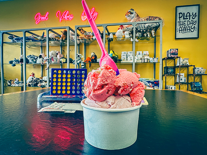 Two scoops of colorful delight, served against a backdrop of toys and games. Ice cream that brings out your inner child while satisfying grown-up taste buds.