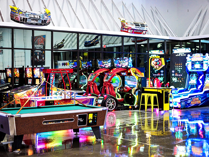 When your arms need a break from wrestling hairpin turns, the arcade offers a different kind of competition. Same victory dance applies. 