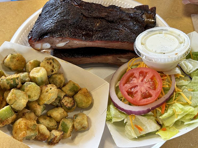 Ribs with that perfect bark, fried okra that could convert a vegetable skeptic, and a salad for those pretending this is a balanced meal.