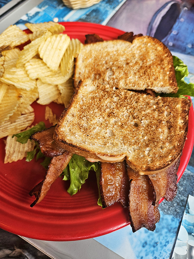 Behold the BLT in its natural splendor&mdash;crispy bacon practically hanging off the edges, perfectly toasted bread, and those potato chips aren't just for show.