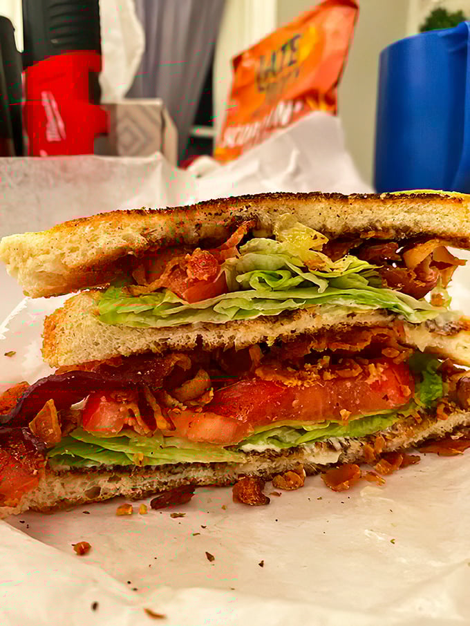 Behold the BLT in all its glory &ndash; layers of crispy bacon, garden-fresh lettuce, and juicy tomato creating the holy trinity of sandwich perfection.