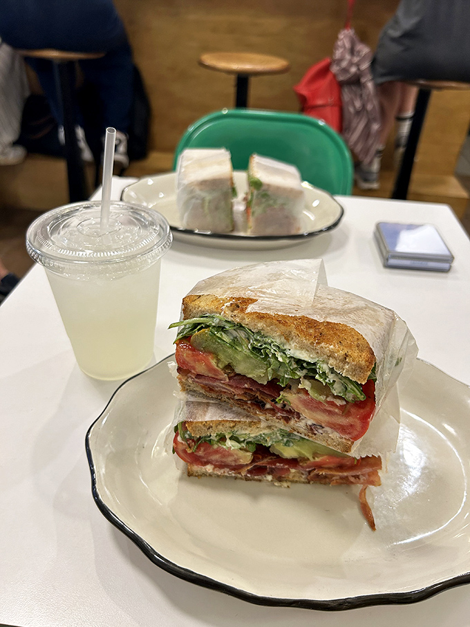 This isn't just a sandwich&mdash;it's architecture. Layers of turkey, bacon, and greens create a skyscraper of flavor between perfectly toasted bread. 
