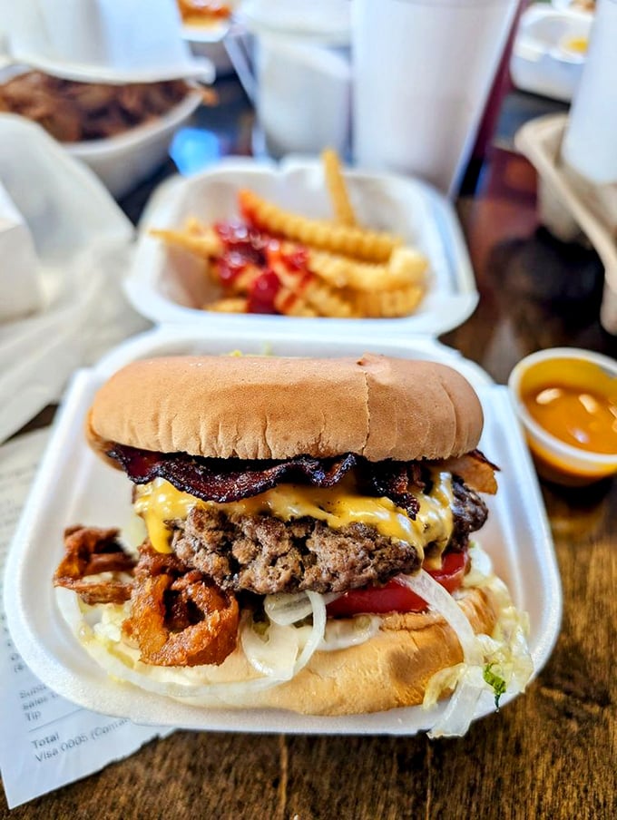 A masterpiece of melted cheese cascading over a juicy patty with crispy bacon - this isn't just lunch, it's an afternoon commitment.