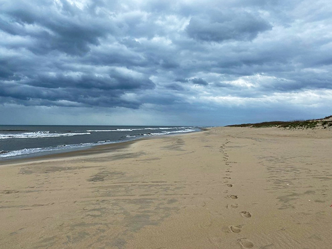Footprints in the sand tell the story of the day's few visitors. Nature's guestbook is refreshingly uncrowded here.