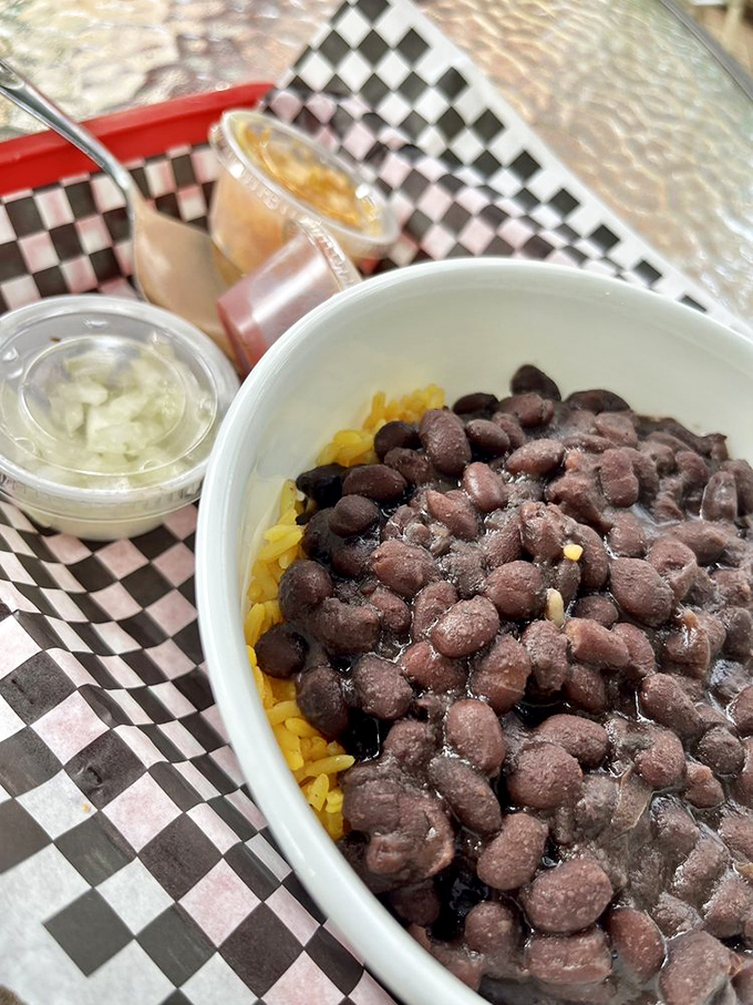 Black beans over yellow rice&mdash;Florida's comfort food answer to chicken soup. Simple, hearty, and exactly what you need after antiquing all morning.