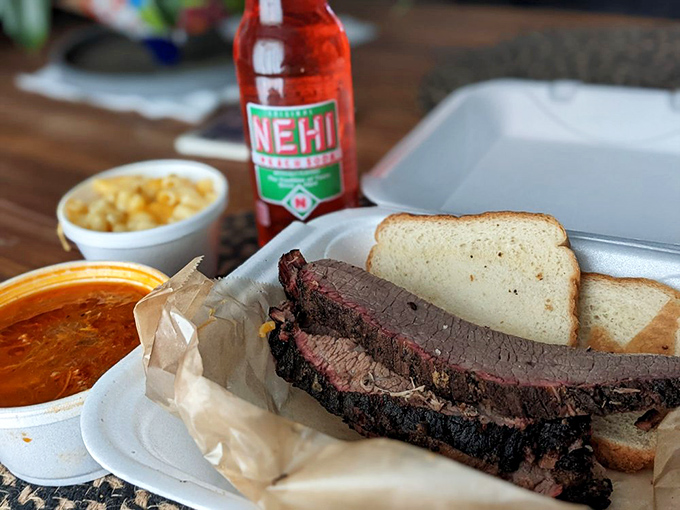 Behold, the brisket of dreams&mdash;dark bark exterior giving way to that telltale pink smoke ring. The perfect companion? An ice-cold Nehi.