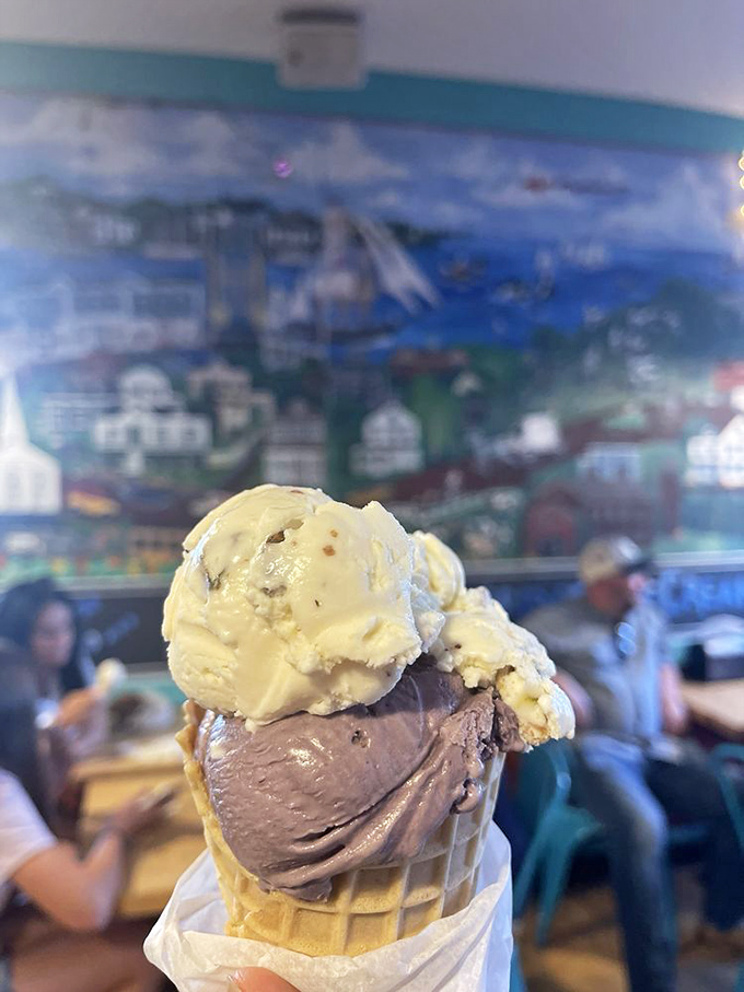Two scoops, infinite joy. This cone showcases the perfect marriage of creamy chocolate and nutty pistachio against a backdrop of Mystic's maritime charm.