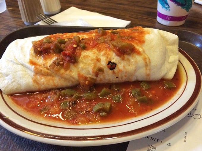 This isn't just a breakfast burrito—it's edible architecture, with that red chile sauce creating a flavor foundation Frank Lloyd Wright would envy.