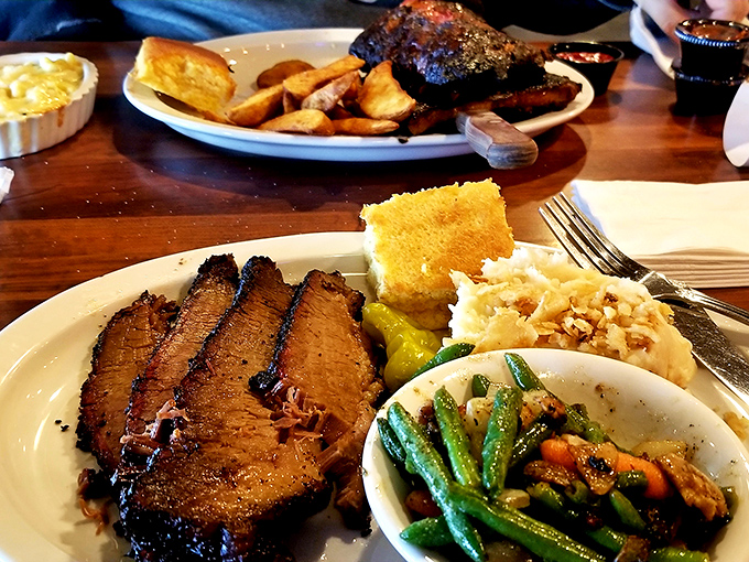 Brisket so perfectly barked and tender it makes you wonder if you've been eating the wrong food your entire life. That smoke ring deserves its own hall of fame.