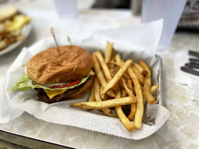Not just another pretty patty&mdash;this burger arrives on its paper throne with perfectly golden fries, ready to solve whatever ails you.
