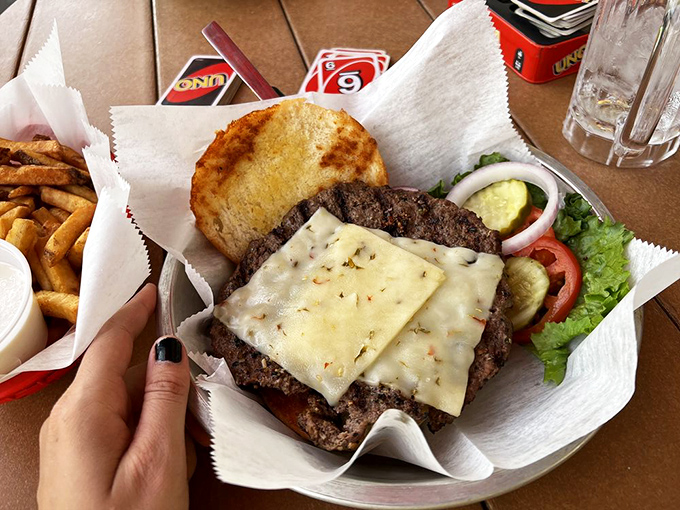 This isn't just a cheeseburger—it's a masterclass in beef-to-bun ratio, with melted cheese that clings to the patty like it's afraid of abandonment.